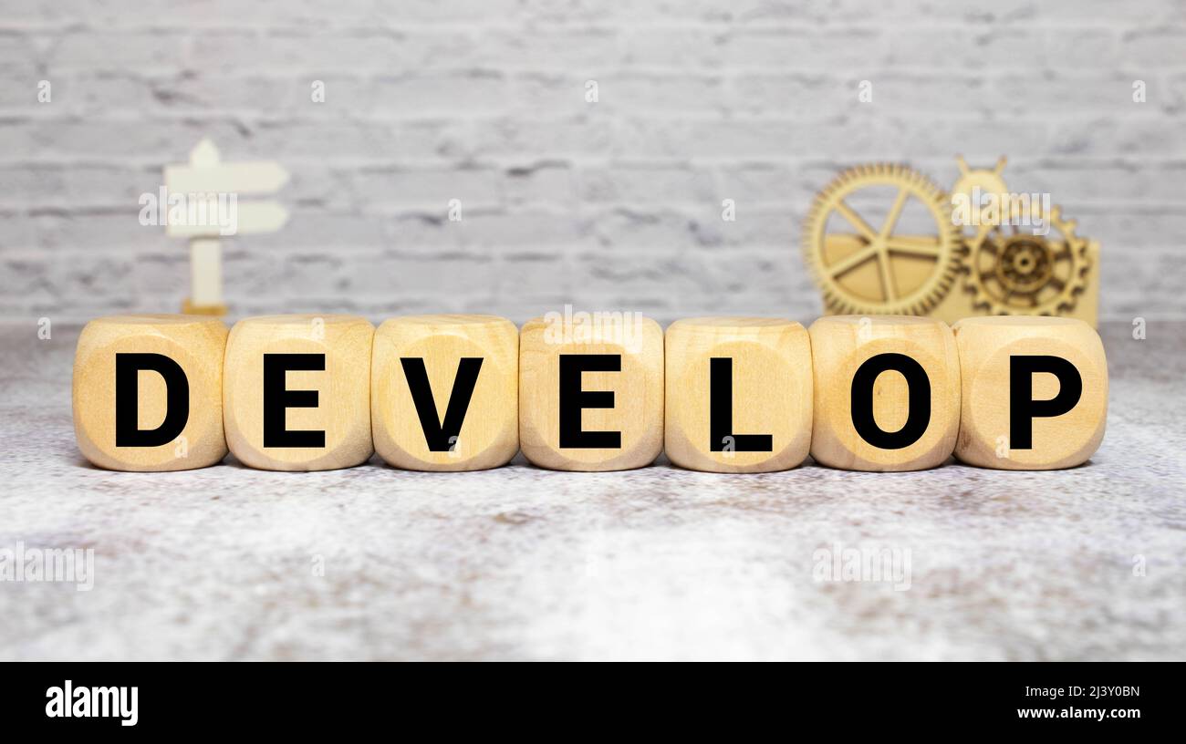 Develop word written on wood block. Develop text on cement table for ...