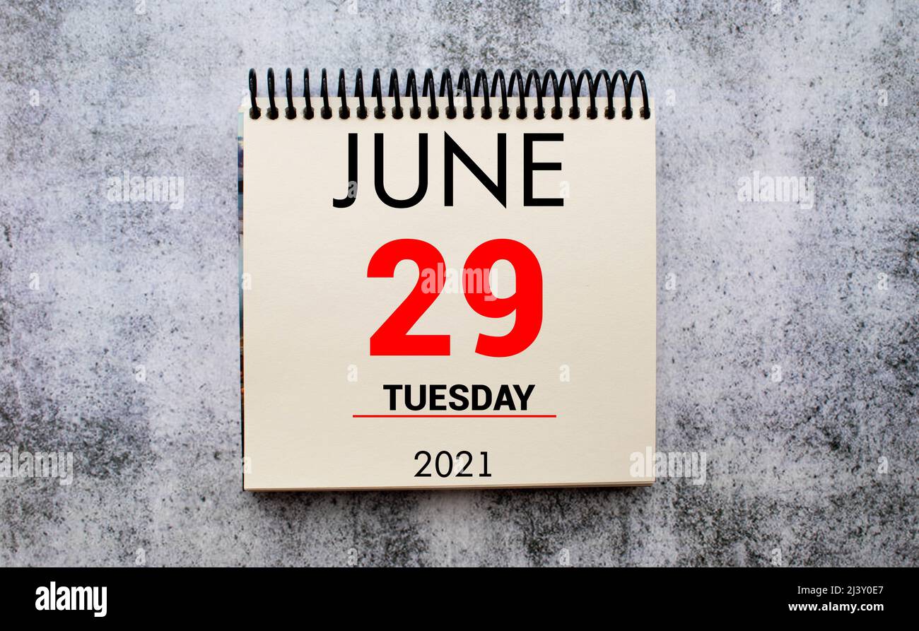 June 29th. 29 June calendar on the wood photo frame with brown brick ...