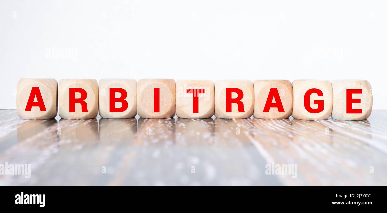 ARBITRAGE word made with building blocks Stock Photo - Alamy