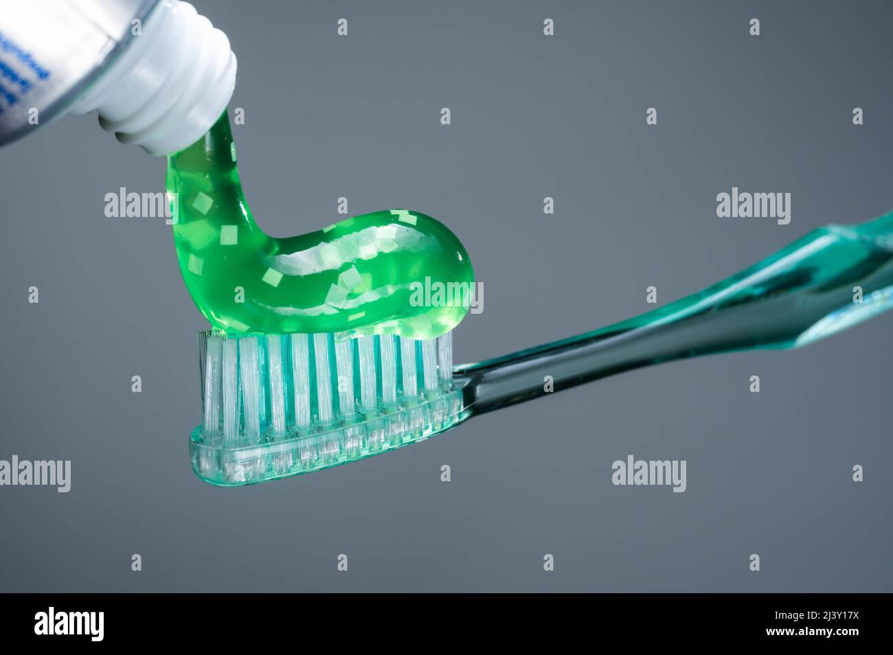 Toothpaste and toothbrush. Apply toothpaste to the brush. Tube ...