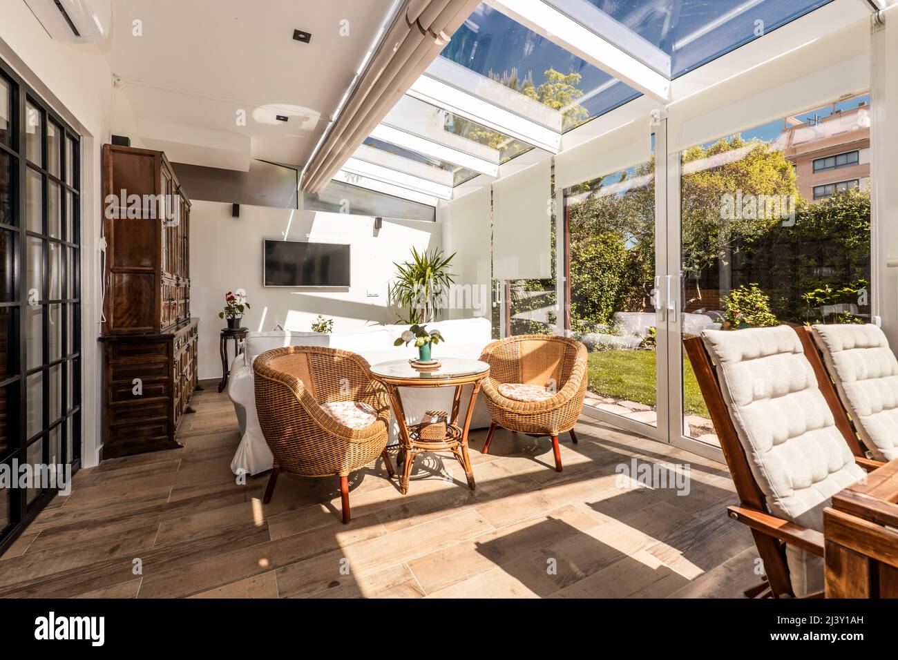 Interior of a closed white aluminum and glass terrace with large closed ...
