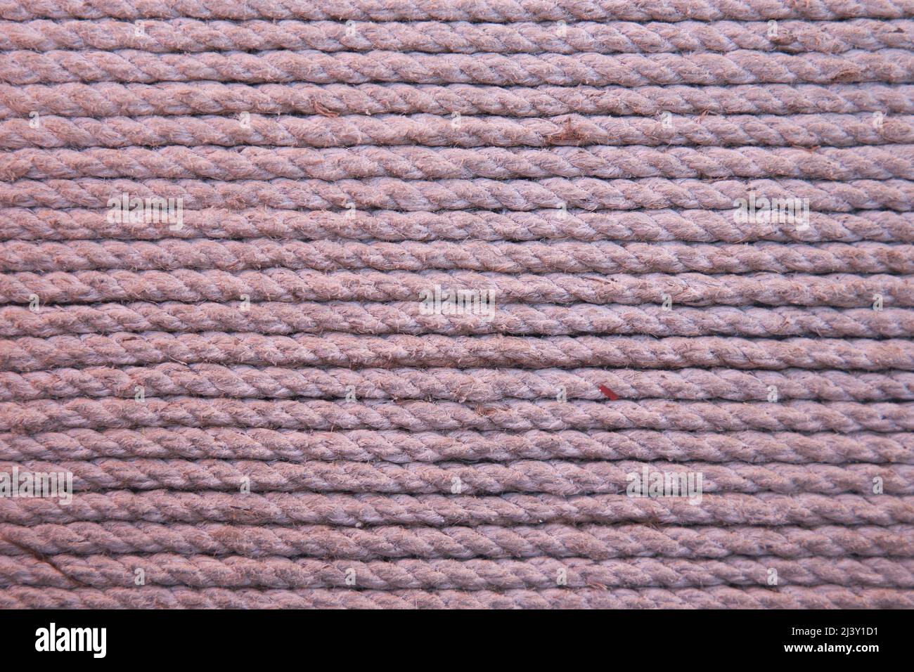 Rope laid in rows as background or backdrop Stock Photo - Alamy