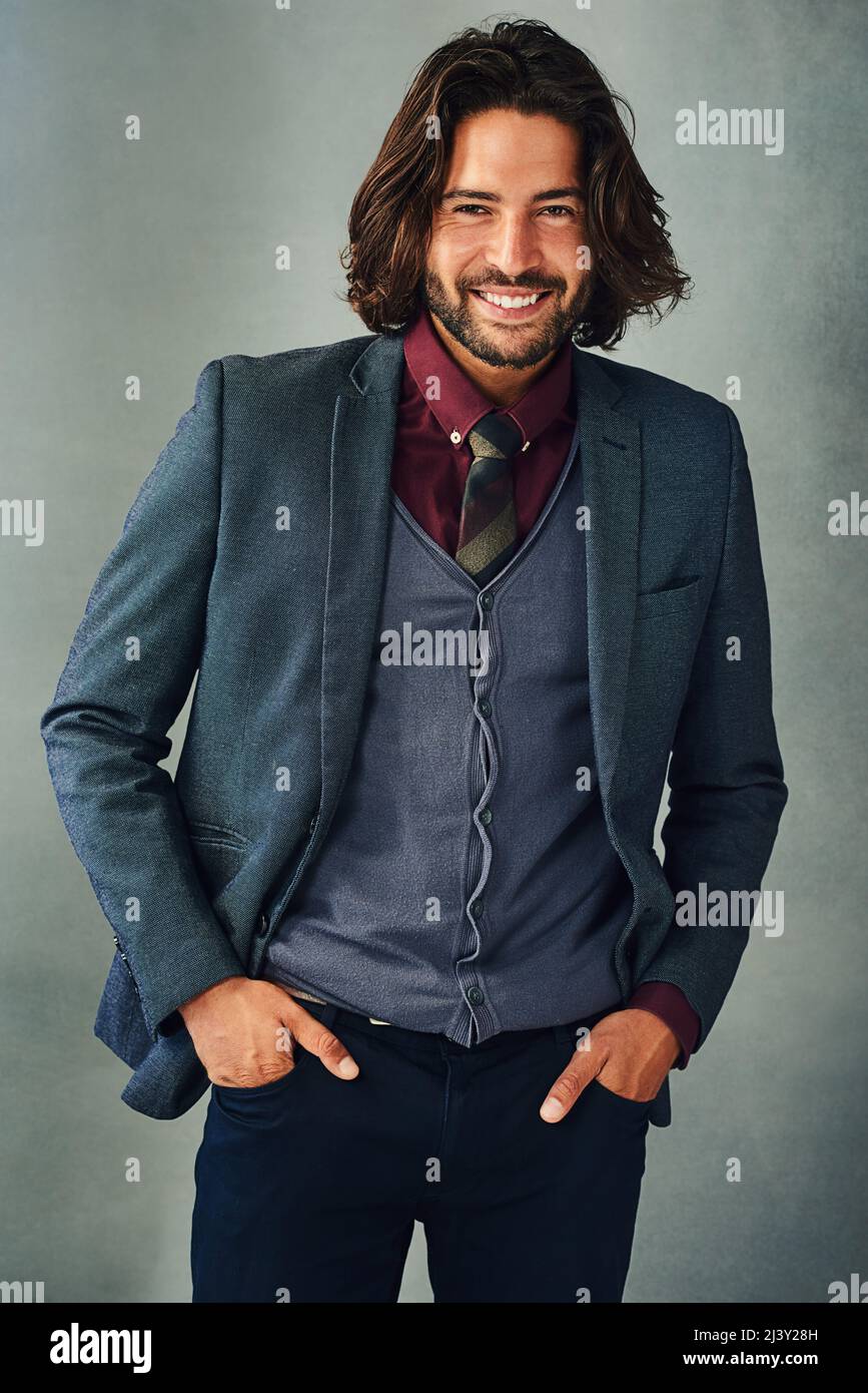 Laid back cool and sophistication. Studio portrait of a stylishly ...