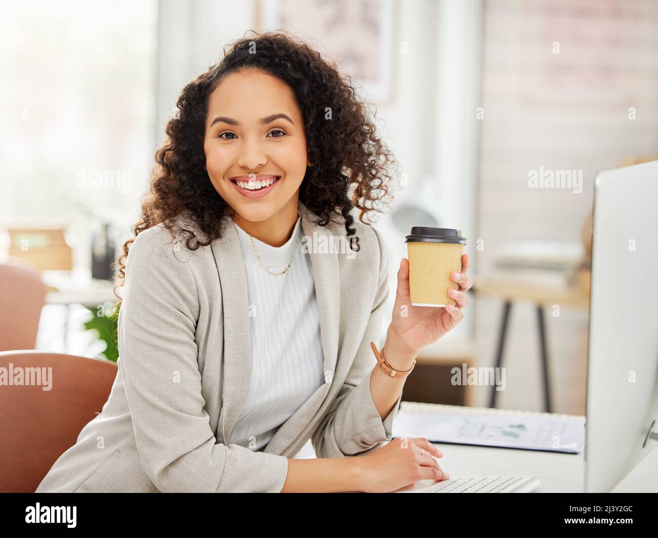 Coffee gives me the kick I need for some productivity. Portrait of a ...