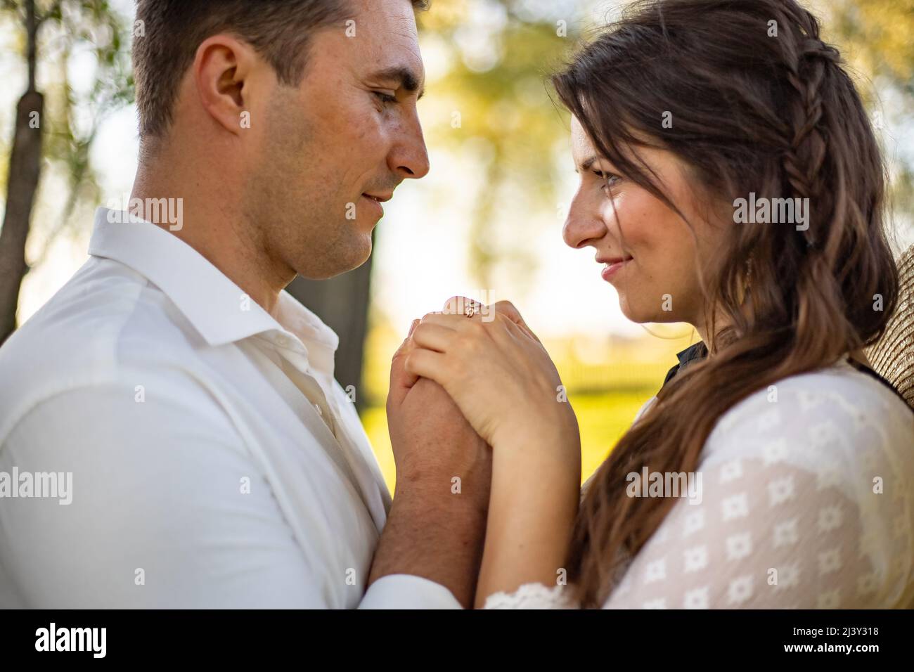 nice portrait of beautiful and young groom and bride outdoors Stock ...