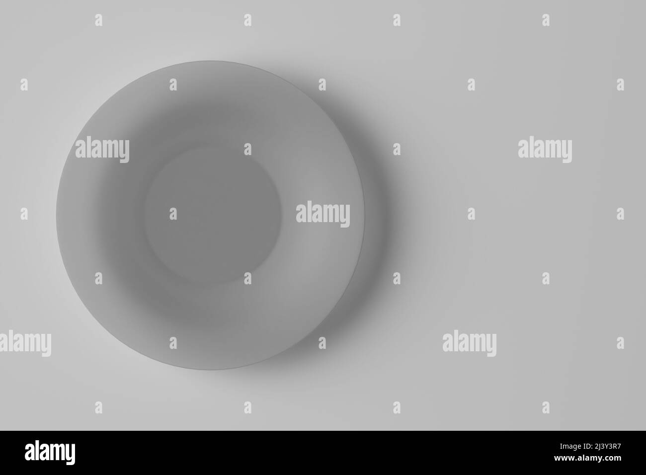 White plate on a white background. View from above. Place for text ...