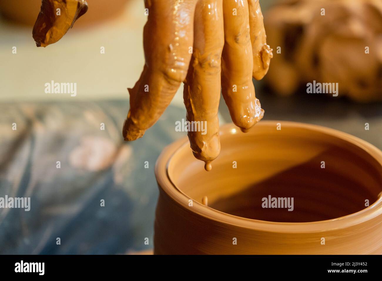 Hands of potter making a clay jug closeup Stock Photo - Alamy