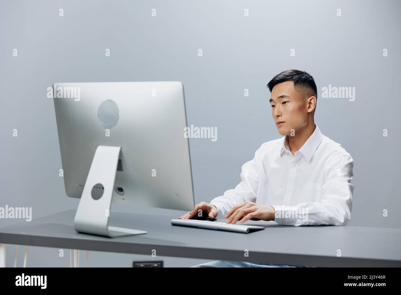 manager sit at a desk in front of a computer isolated background Stock ...