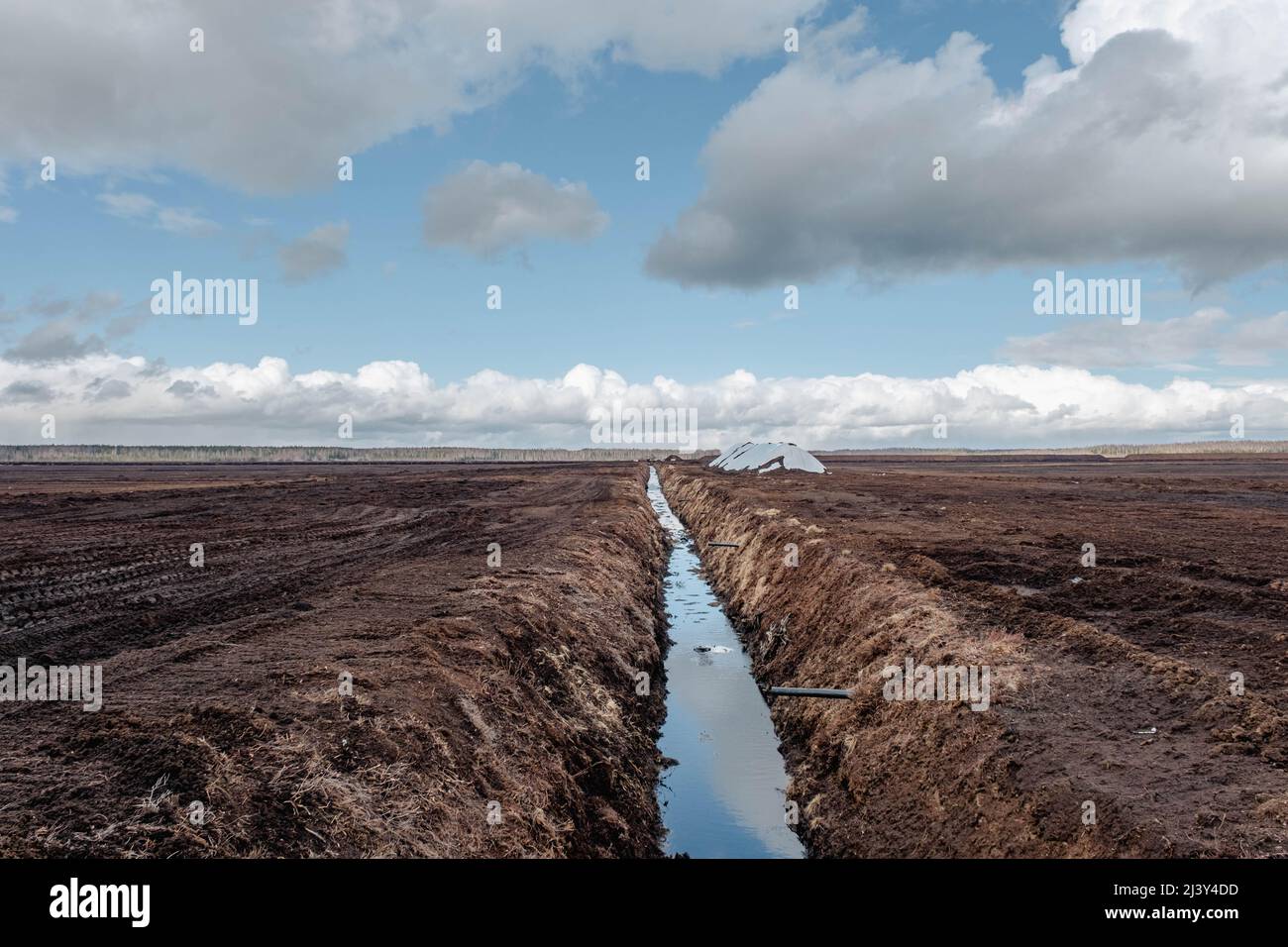 Drainage ditch in the peat extraction site. Drainage and destruction of ...