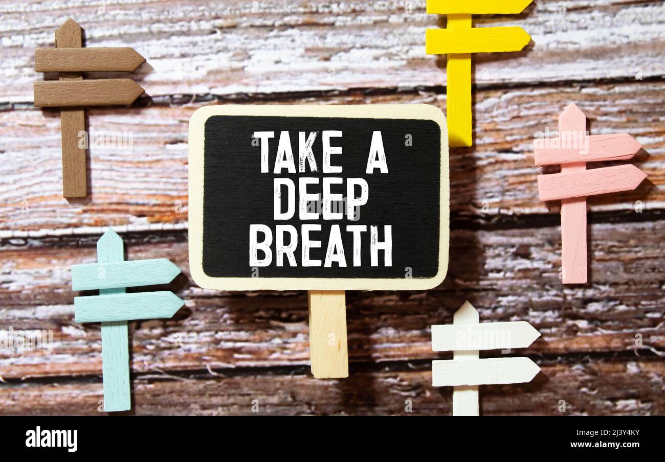 Take a deep breath text on black plate, concept Stock Photo - Alamy