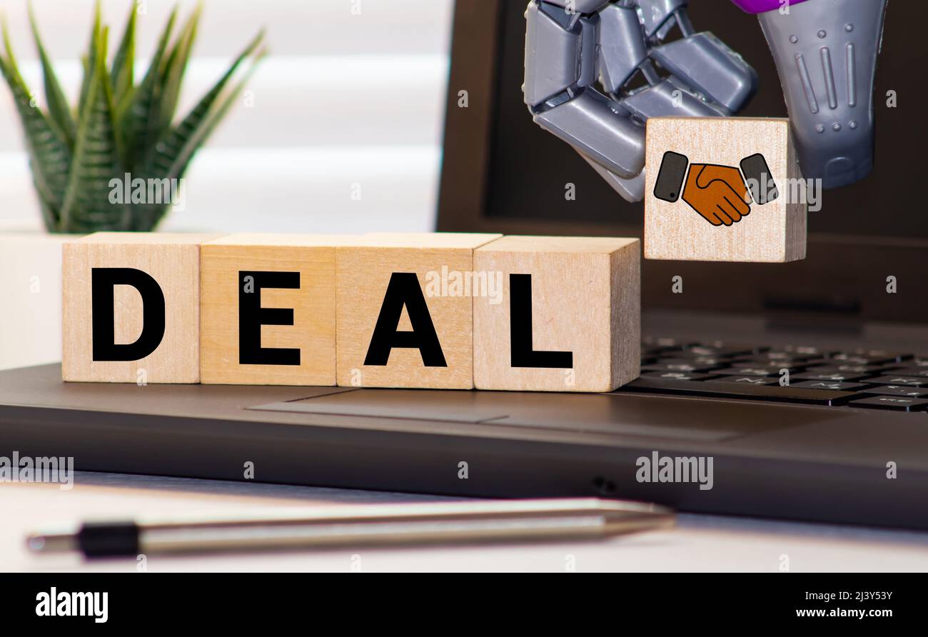 Deal or no deal. Hand turns a dice and changes the word Stock Photo - Alamy