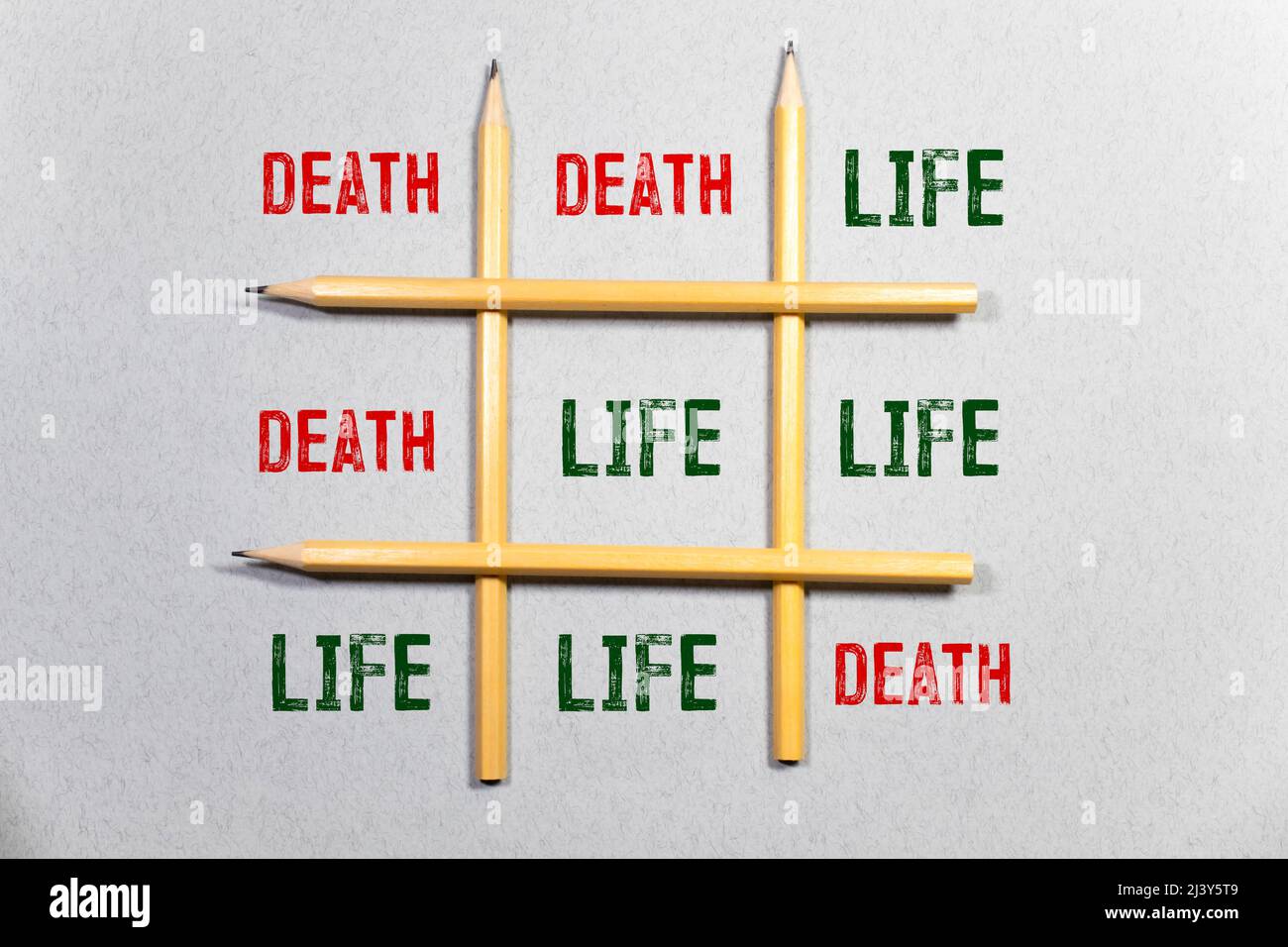 Death and Life words written on two pieces of jigsaw puzzle Stock Photo ...