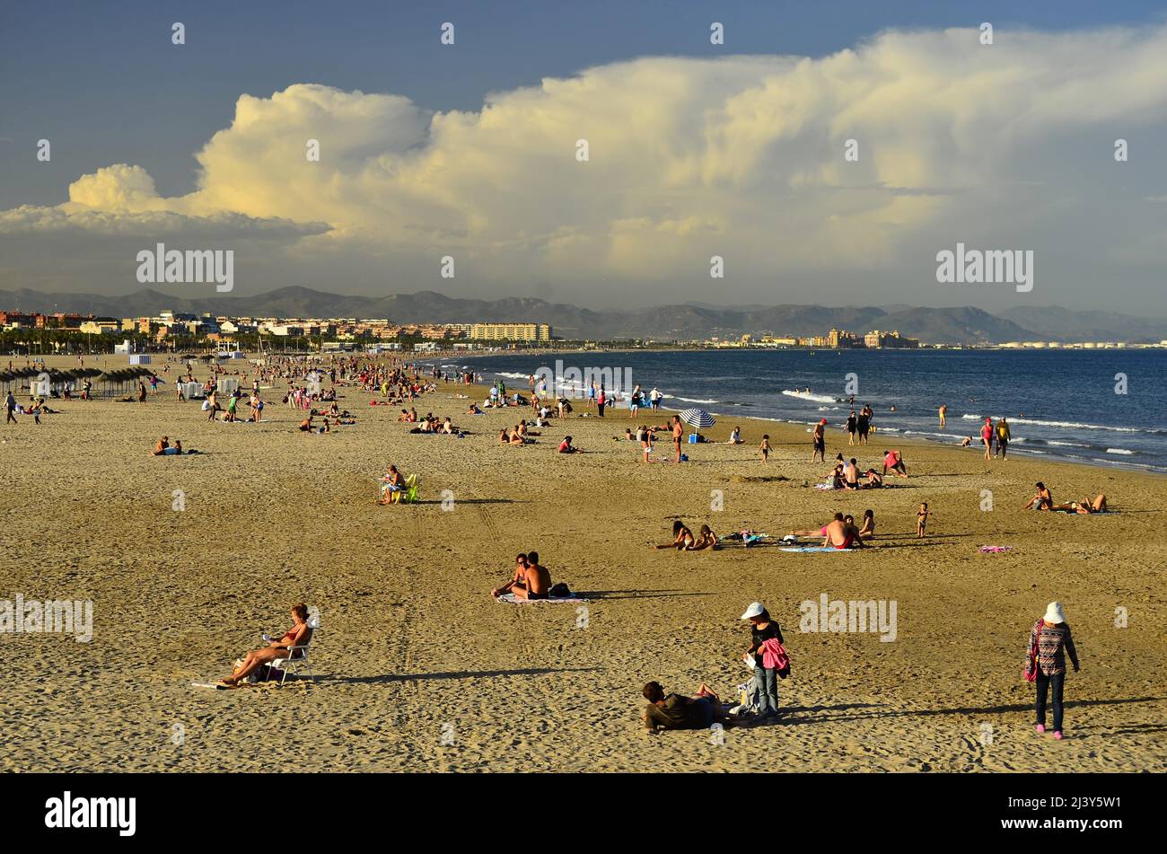 People on the sandy beach in Valencia Spain Stock Photo - Alamy
