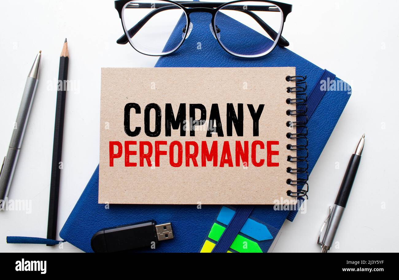 White paper with text concept word COMPANY PERFORMANCE on the office ...