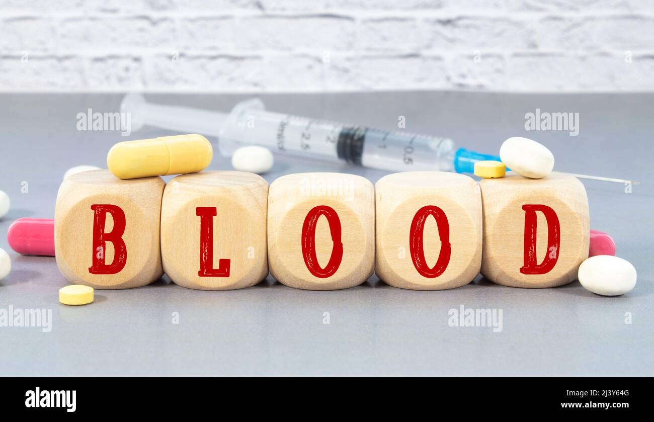 word blood from wooden letters lies red backgound Stock Photo - Alamy