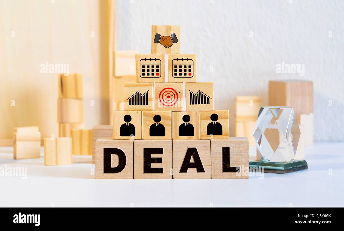 Word - deal - on small wooden blocks on the desk. Conceptual photo. Top ...