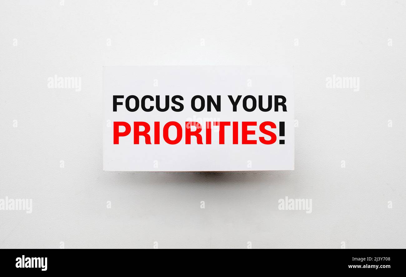 Text focus on your priorities on note paper Stock Photo - Alamy