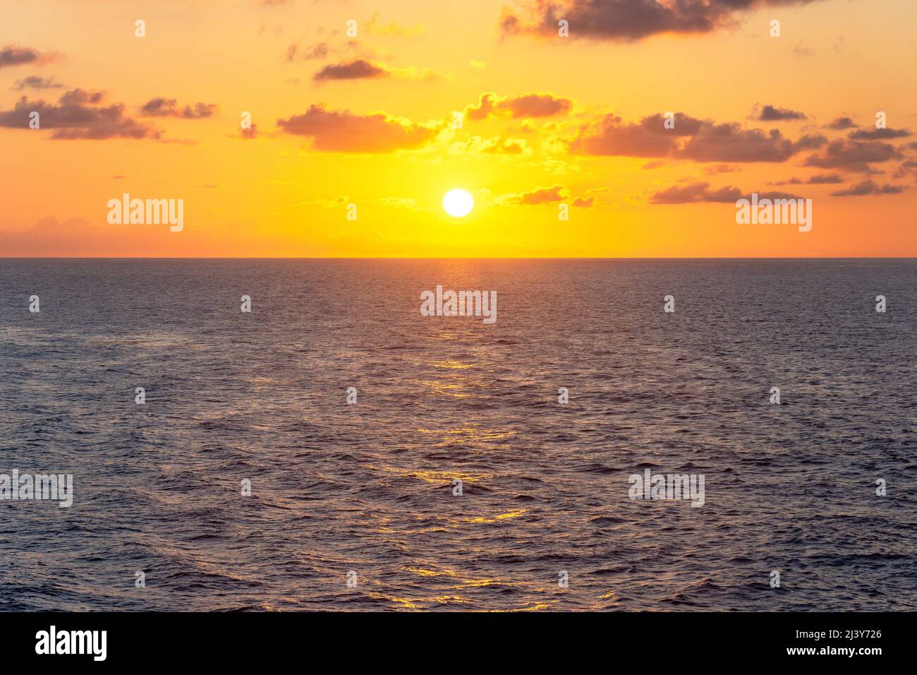 Sun setting over sea from Marella Explorer 2 cruise ship, Caribbean Sea ...