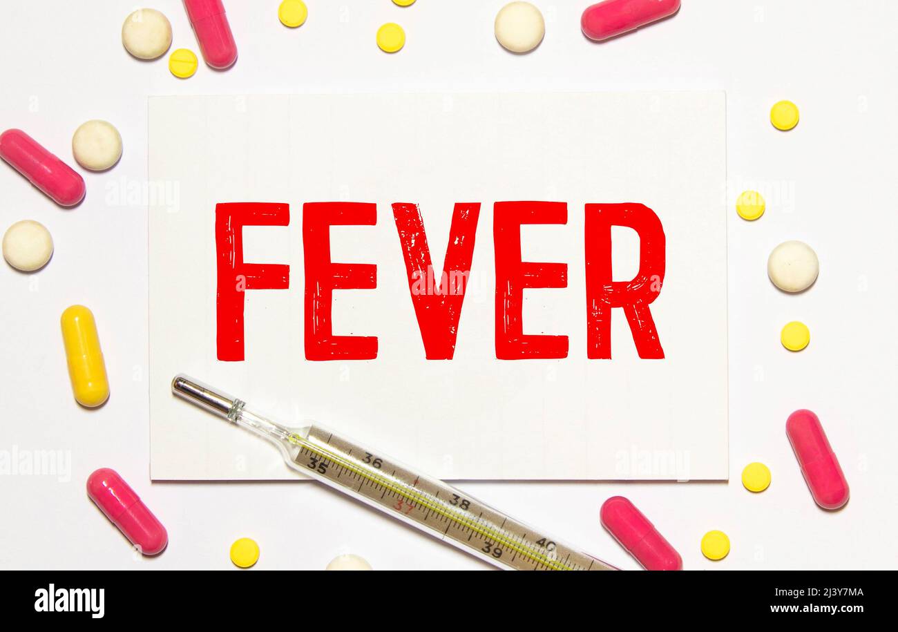 FEVER word made with building blocks. Wooden block with words Fever ...