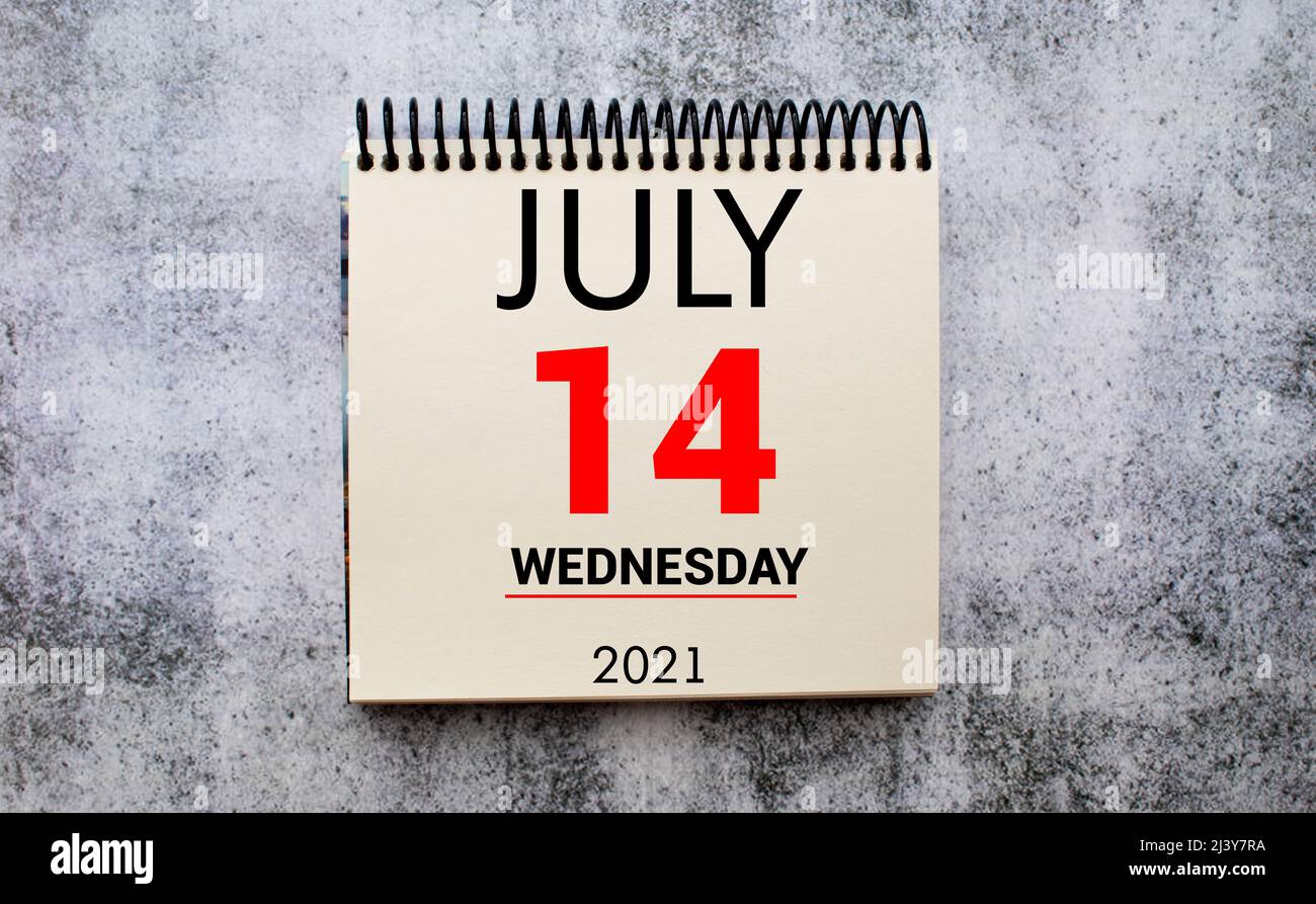 Save the Date written on a calendar - July 14 Stock Photo - Alamy
