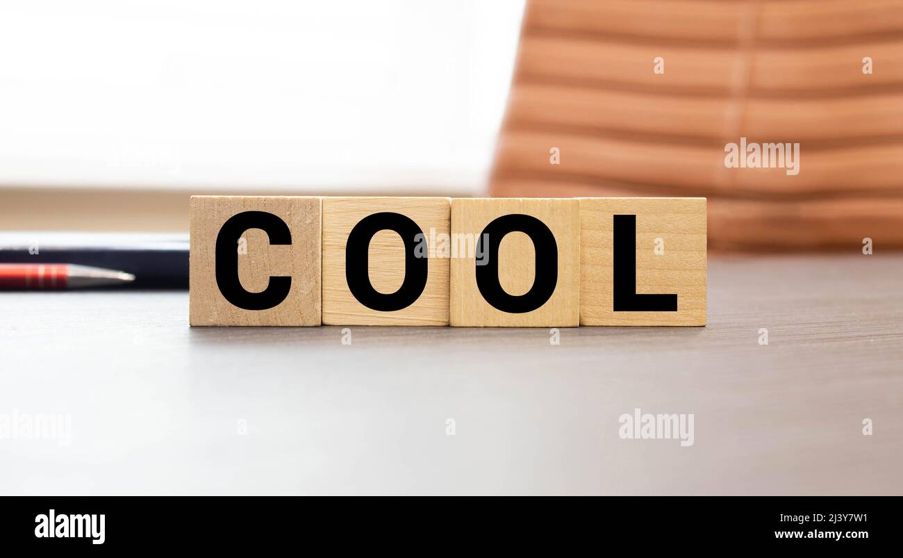 word cool made of wooden block isolated on white background Stock Photo ...