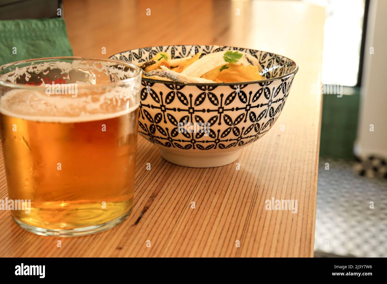 Fresh beer and Spanish tapa on a Spanish bar counter Stock Photo - Alamy