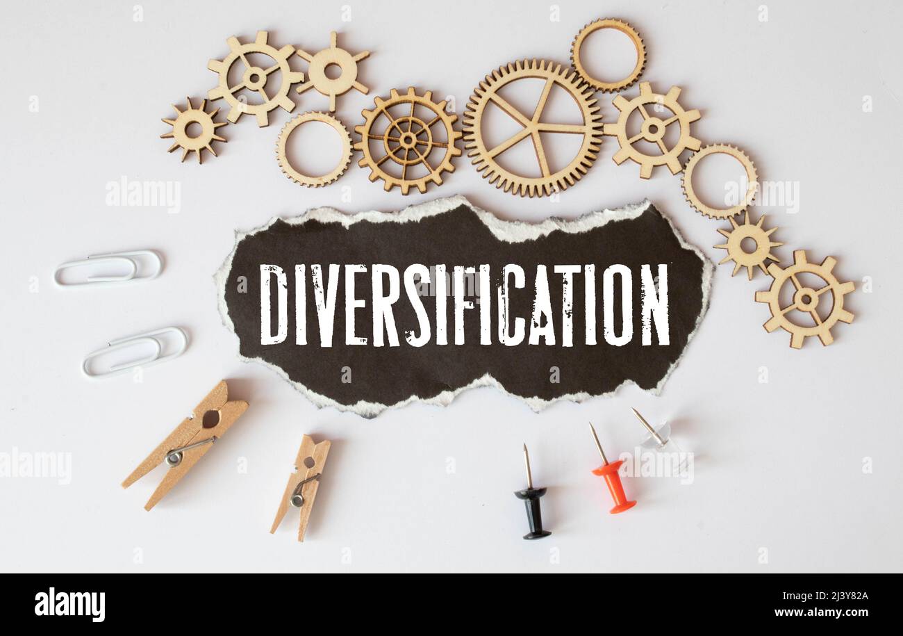word Diversification on black paper Stock Photo - Alamy
