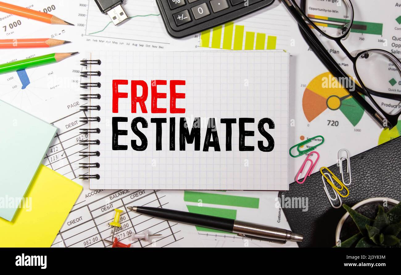 FREE ESTIMATE Businessman working at office desk and using computer and ...