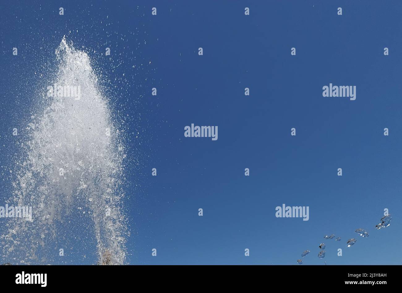 fountain water jet over blue sky background with copy space Stock Photo ...