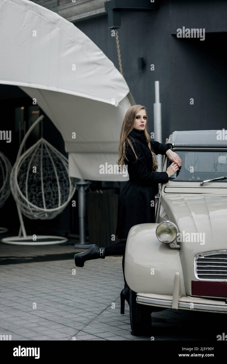 Female model posing car hi-res stock photography and images - Alamy