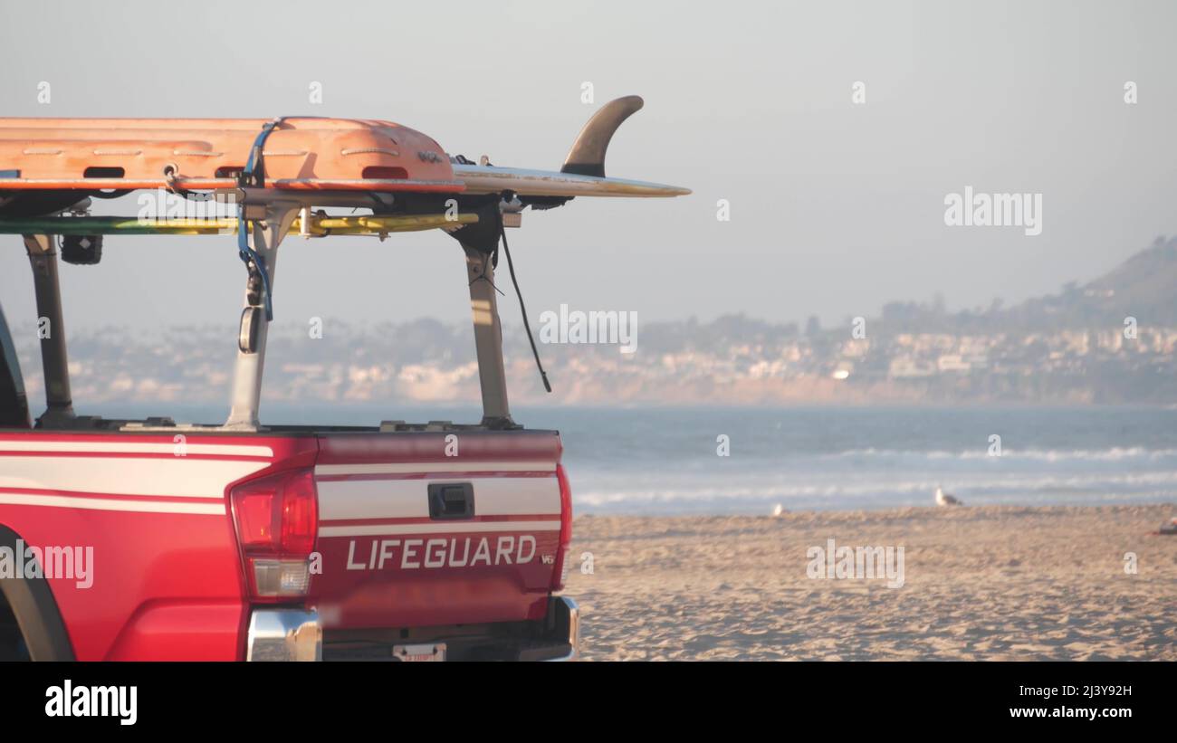 Lifeguard red pickup truck, life guard auto on sand, California ocean ...