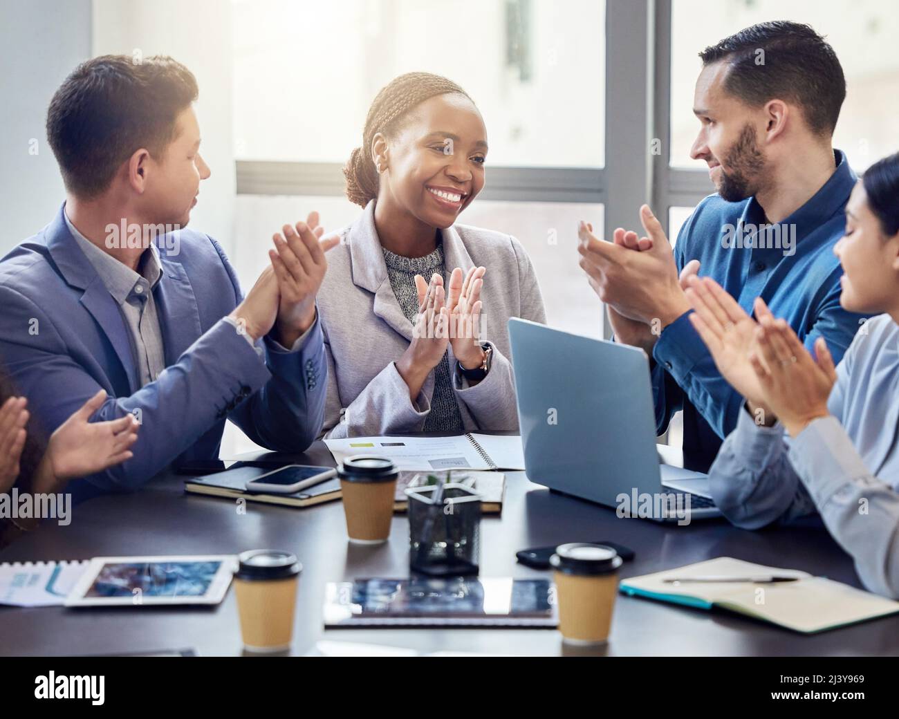 Were all doing really well. Shot of a group of colleagues having a ...