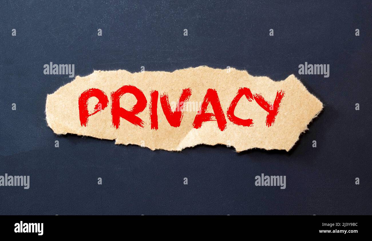 The word Privacy appearing behind torn brown paper Stock Photo - Alamy