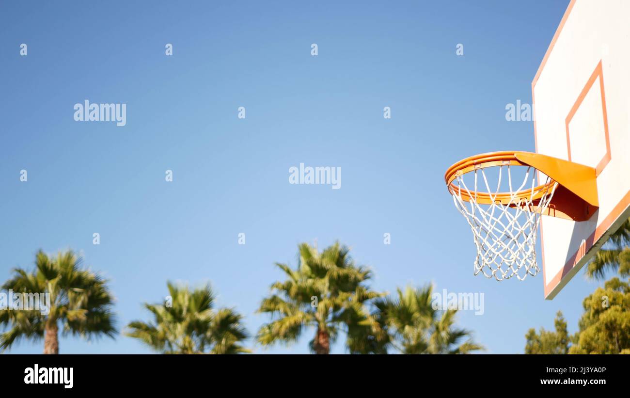 Basketball court outdoors, orange hoop, net and backboard for basket ...