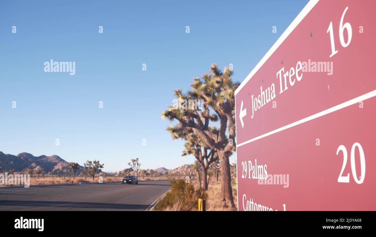 Crossroad sign with direction arrows on road intersection, California ...