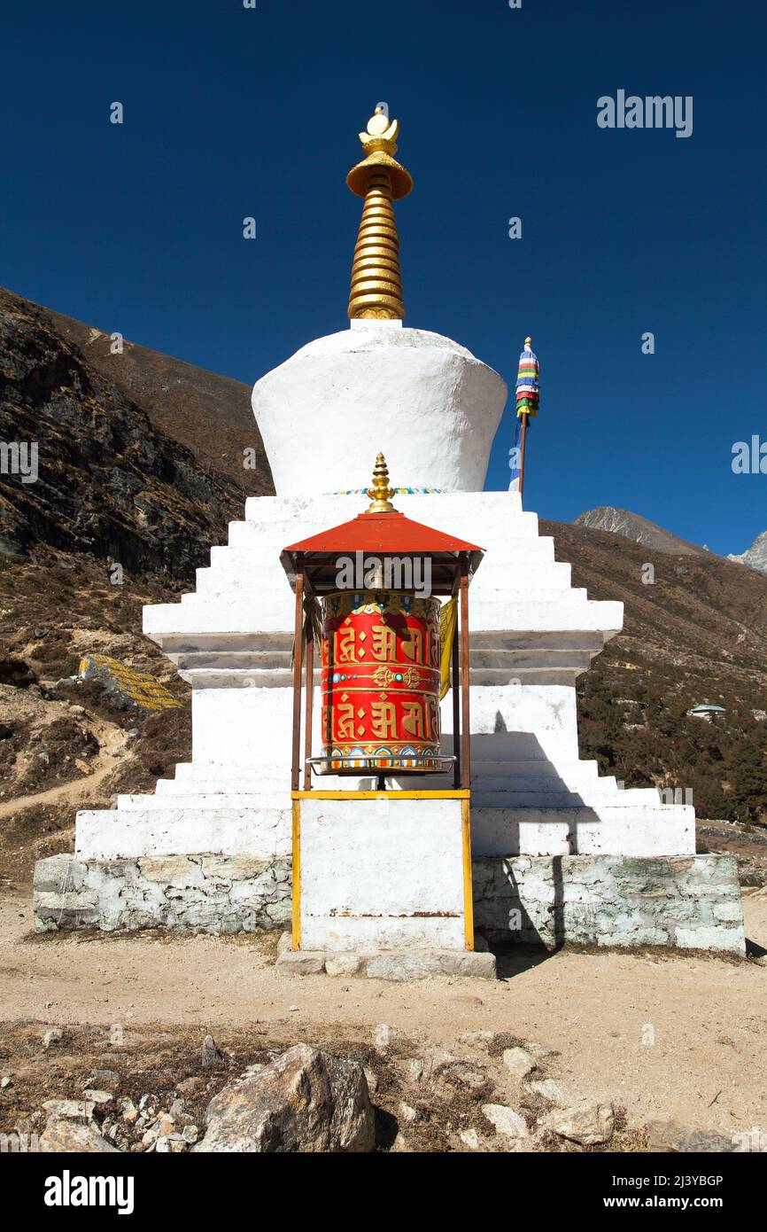 Buddhist stupa and prayer wheel in Thame village, Khumbu valley on ...