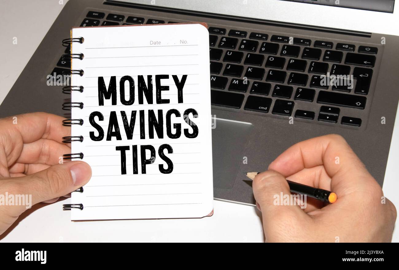 Money saving tips written in a note Stock Photo - Alamy