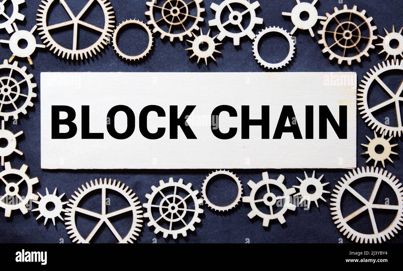 Blockchain word written on wood block. Block chain text on wooden table ...