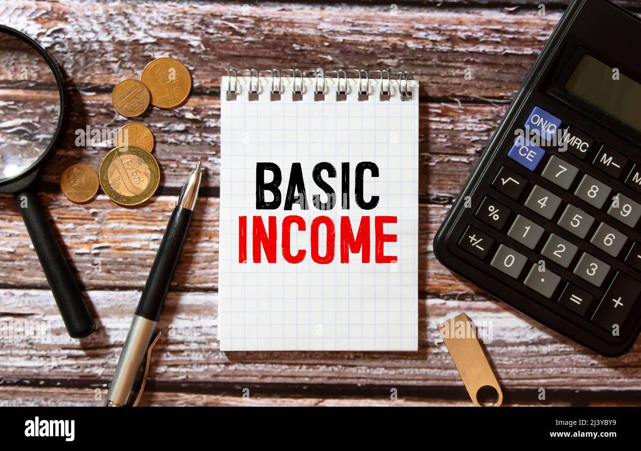 Hand writing Basic income with marker, concept background Stock Photo ...