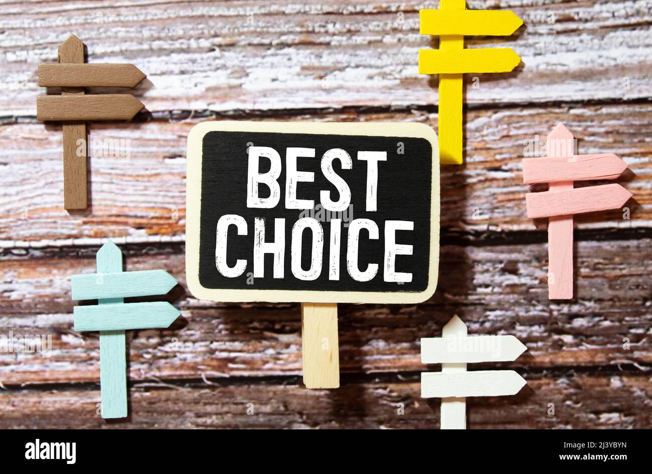 best choice sign a paper price tag against rustic red painted barn wood ...