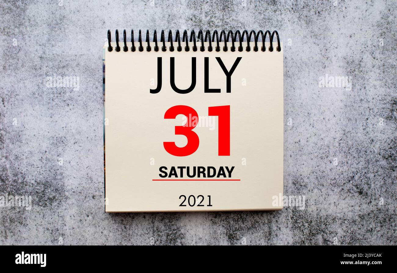 July 31th. 31 July calendar on the wood photo frame with brown brick ...