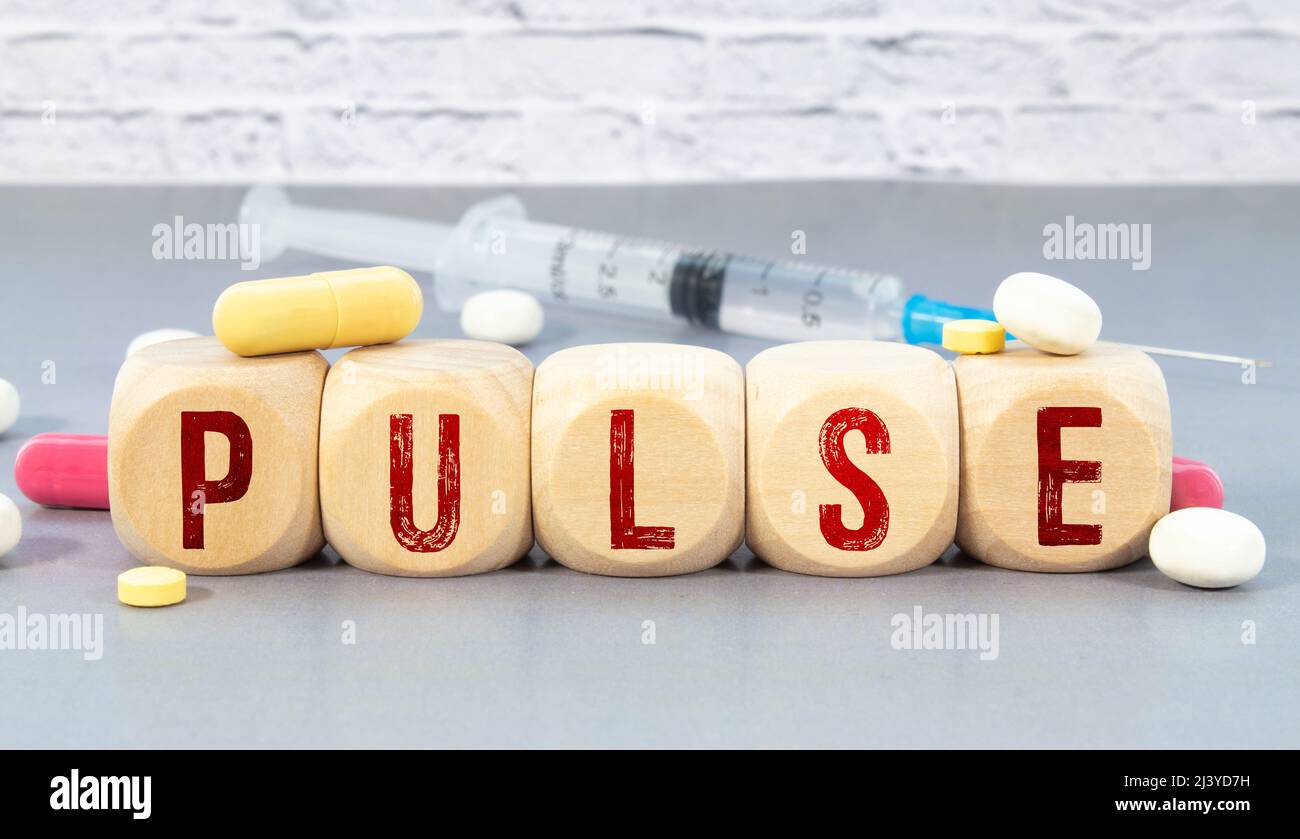 PULSE - words from wooden blocks with letters, feel worried and nervous ...