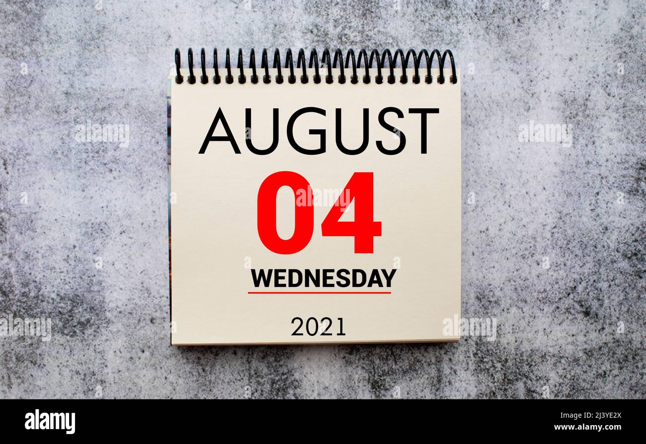 Save the Date written on a calendar - August 04 Stock Photo - Alamy