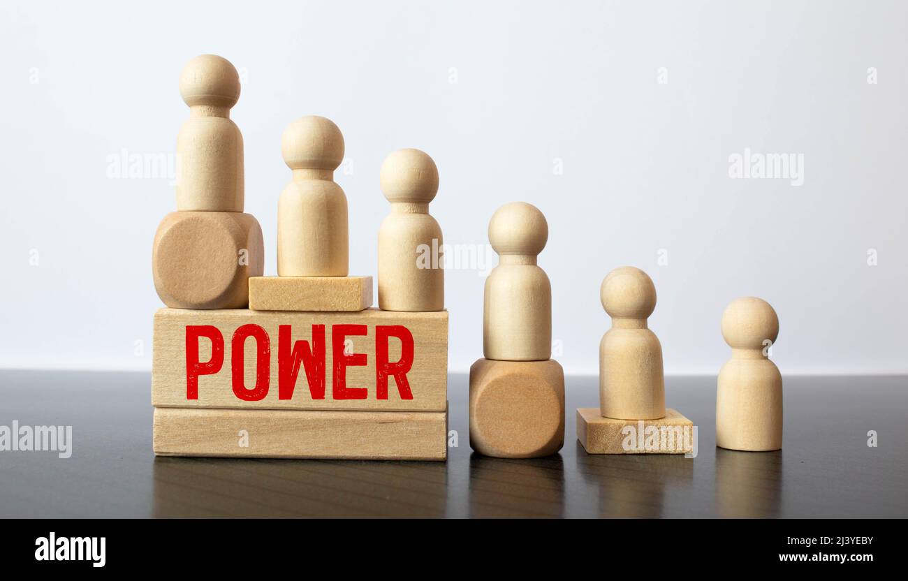 Businessman hand holding wooden cube block with POWER business word on ...