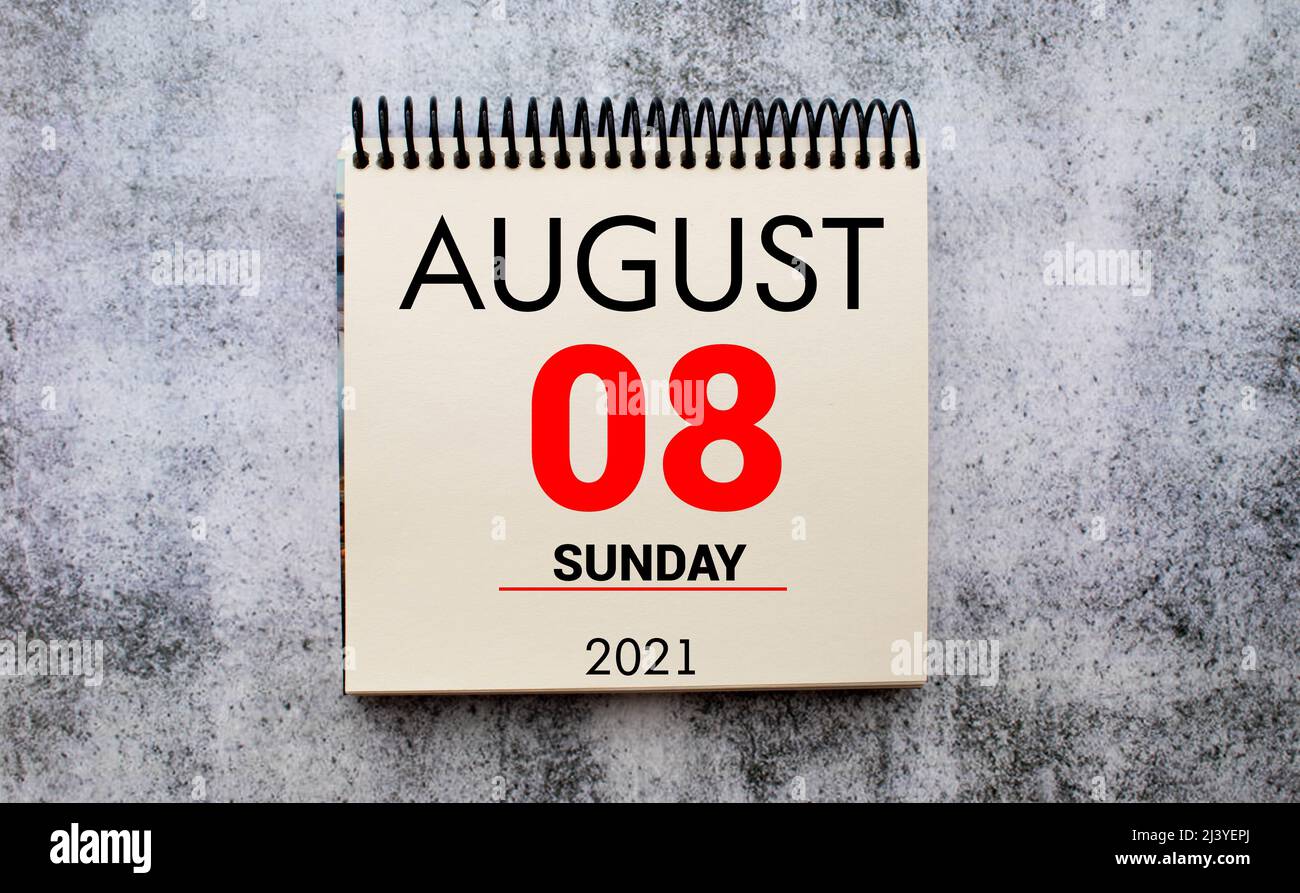 Woman fingers with pen writing reminder The Day to Create in calendar ...