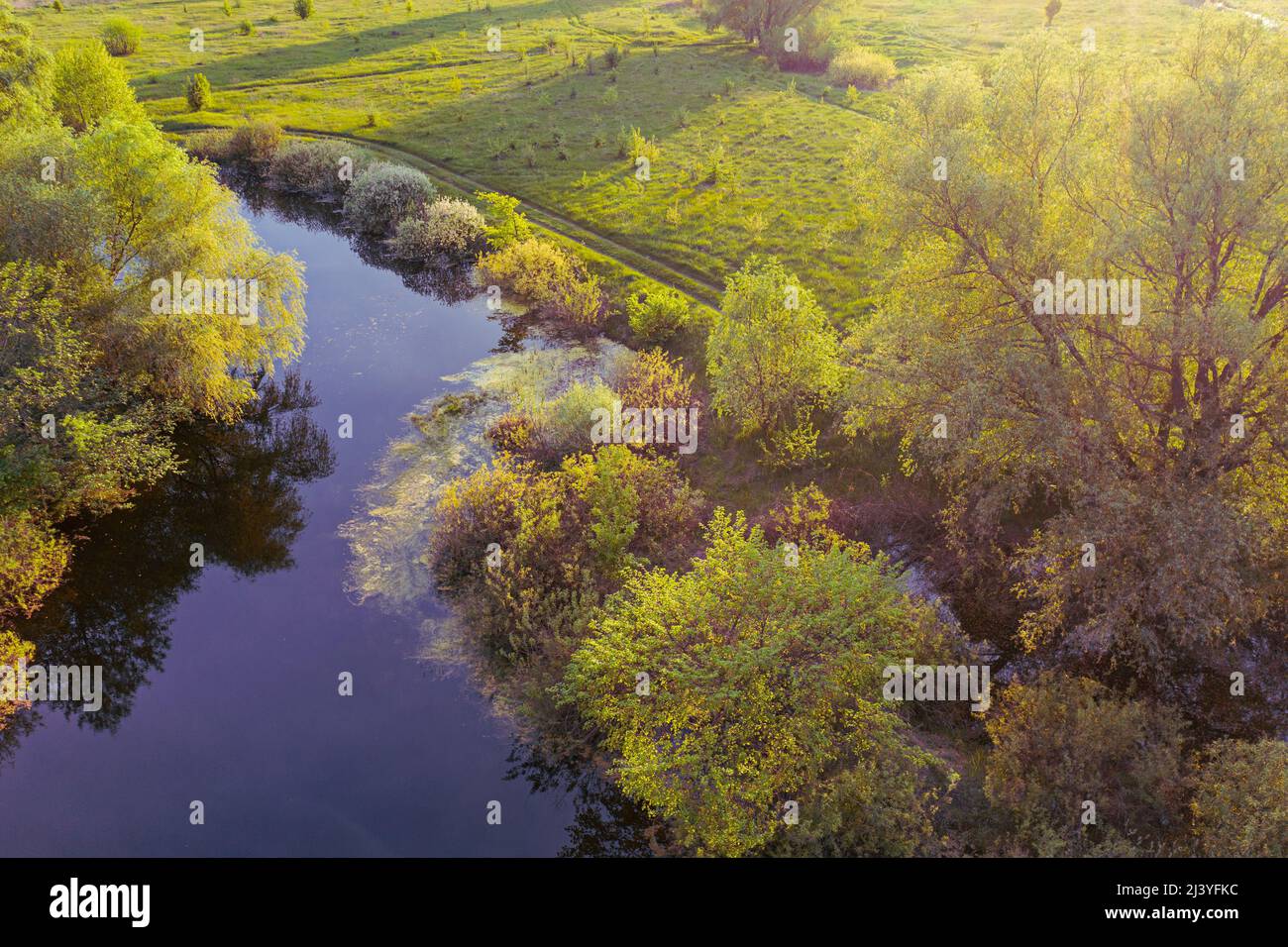 Spring landscape with river Stock Photo - Alamy