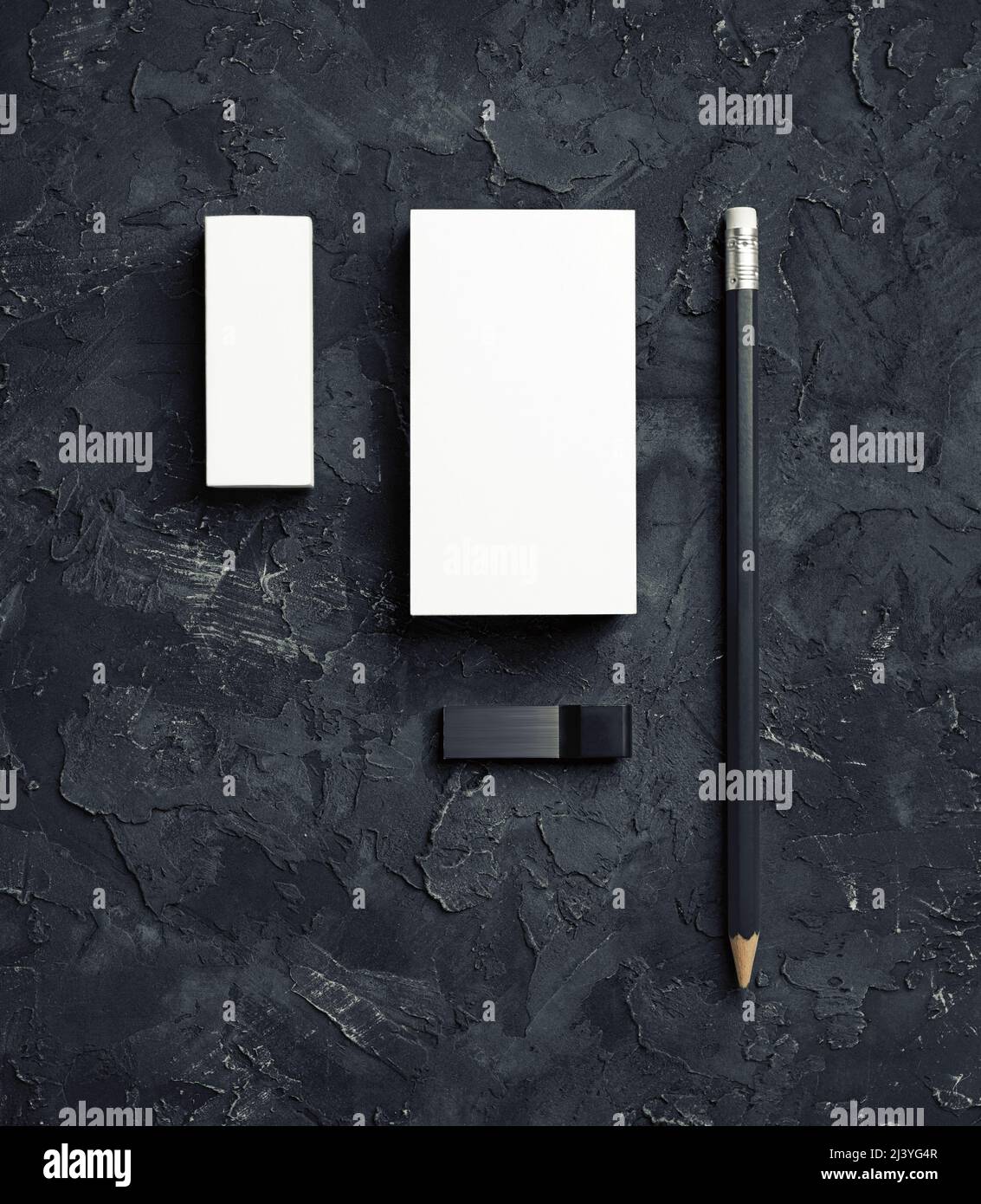 Blank business card, pencil, usb flash drive and eraser on black ...