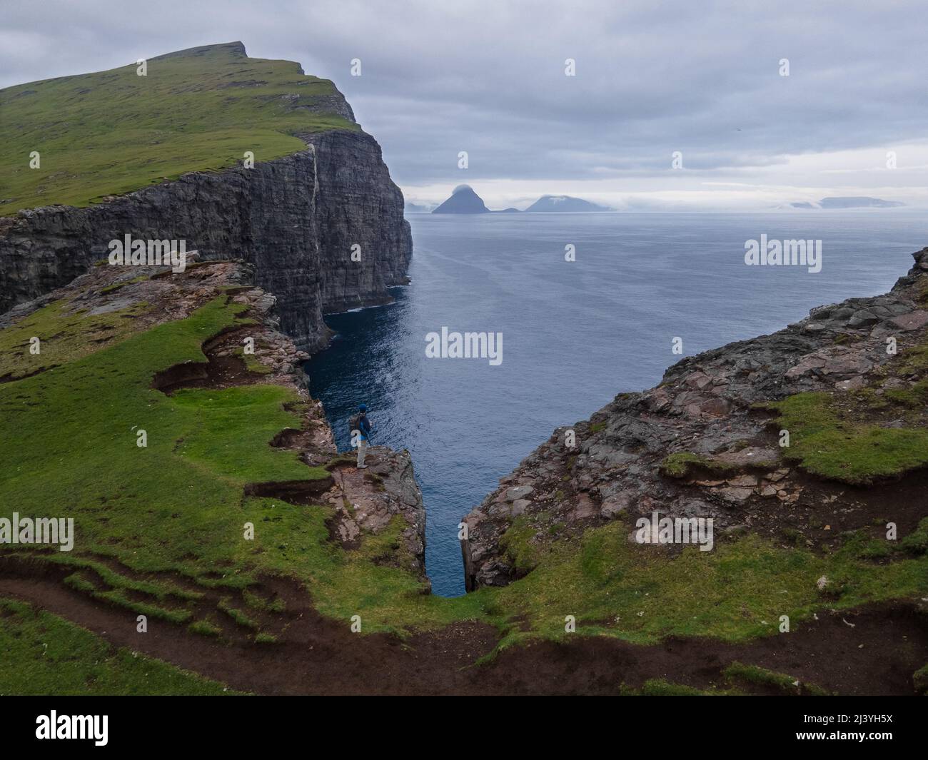 Beautiful cinematic aerial view of the Bøsdalafossur waterfall and ...