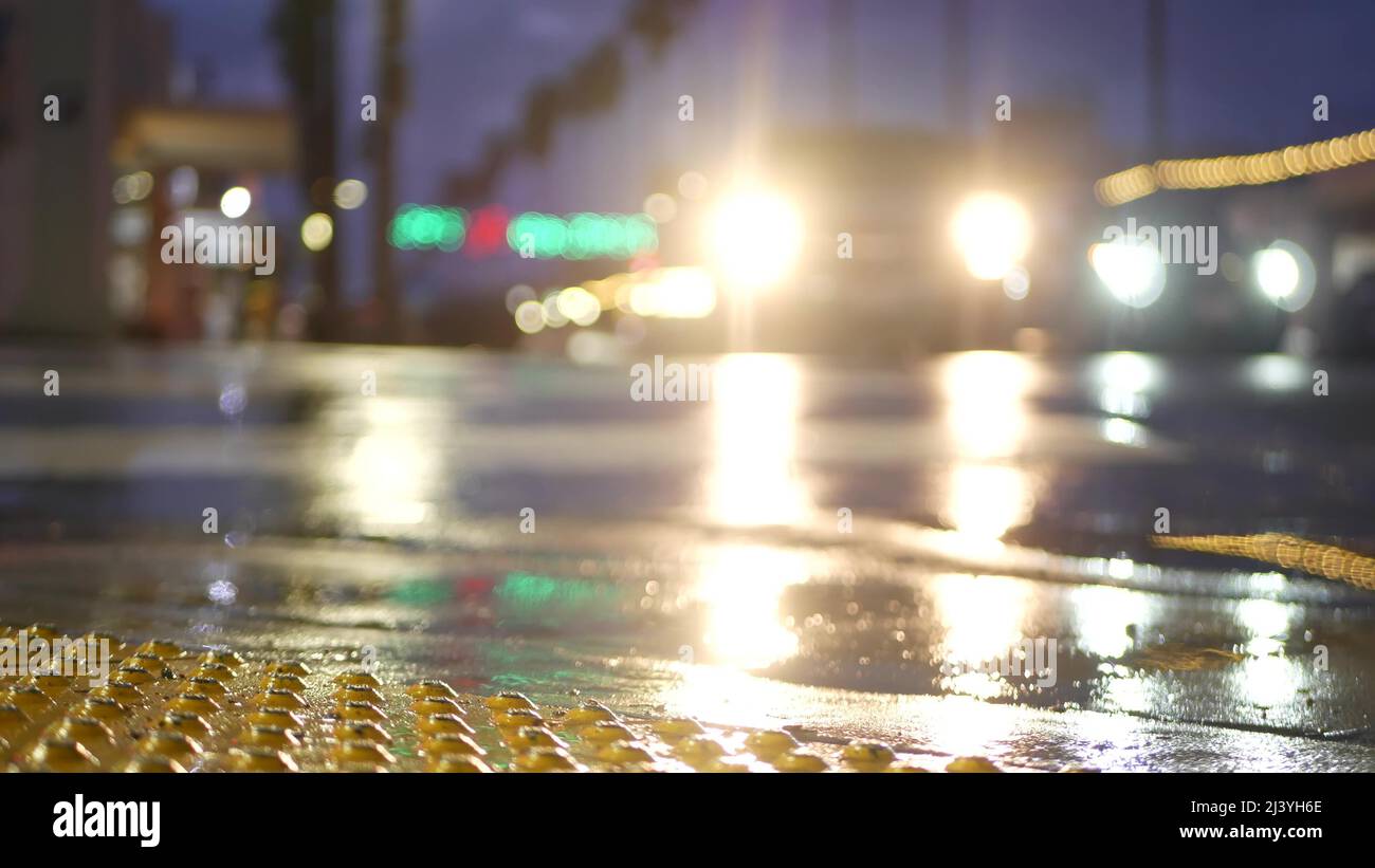 Cars lights reflection on road in rainy weather. Rain drops on wet ...