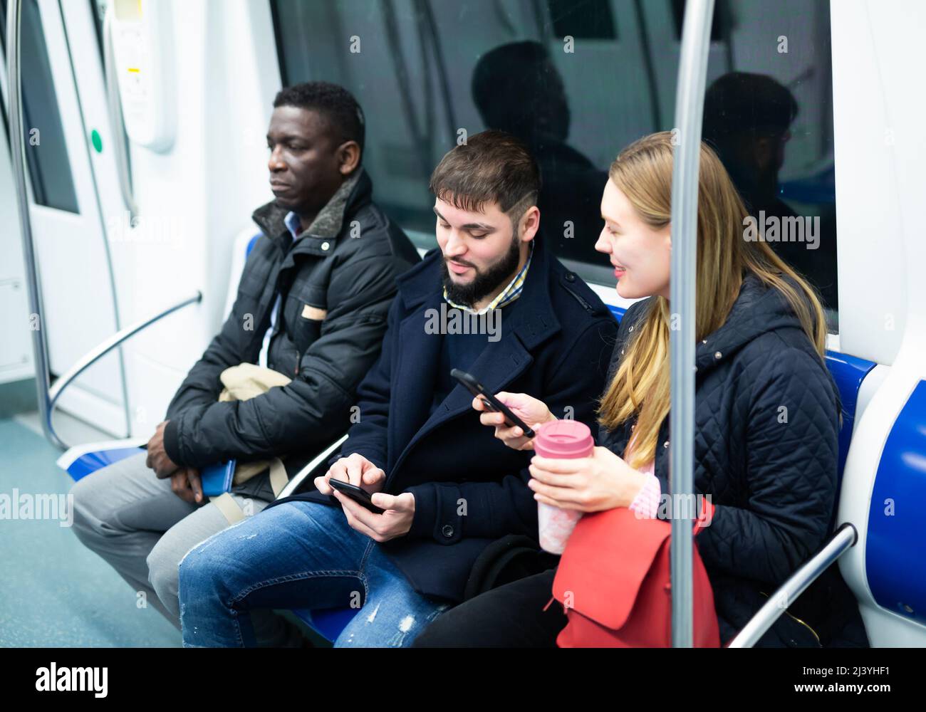 People riding subway Stock Photo - Alamy